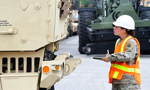 Transportation soldier uses command signals to a fellow transportation ...
